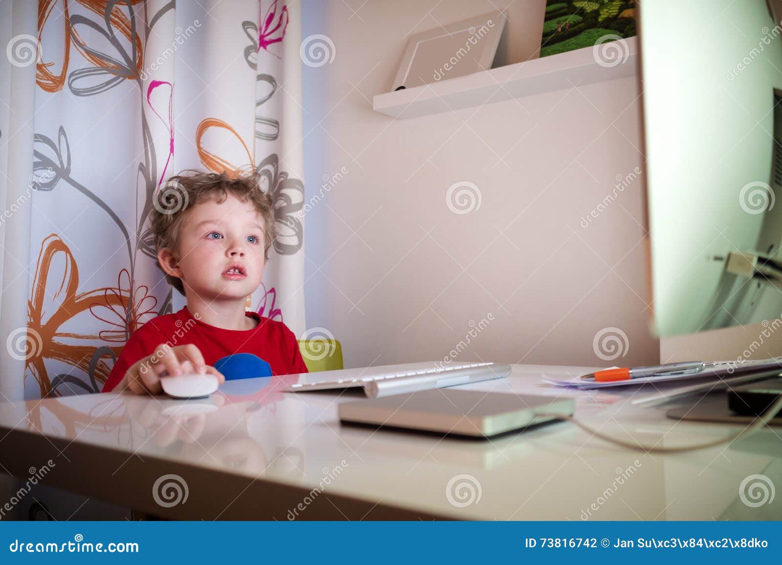 Young Boy Playing with Computer at Night Stock Photo - Image of ...