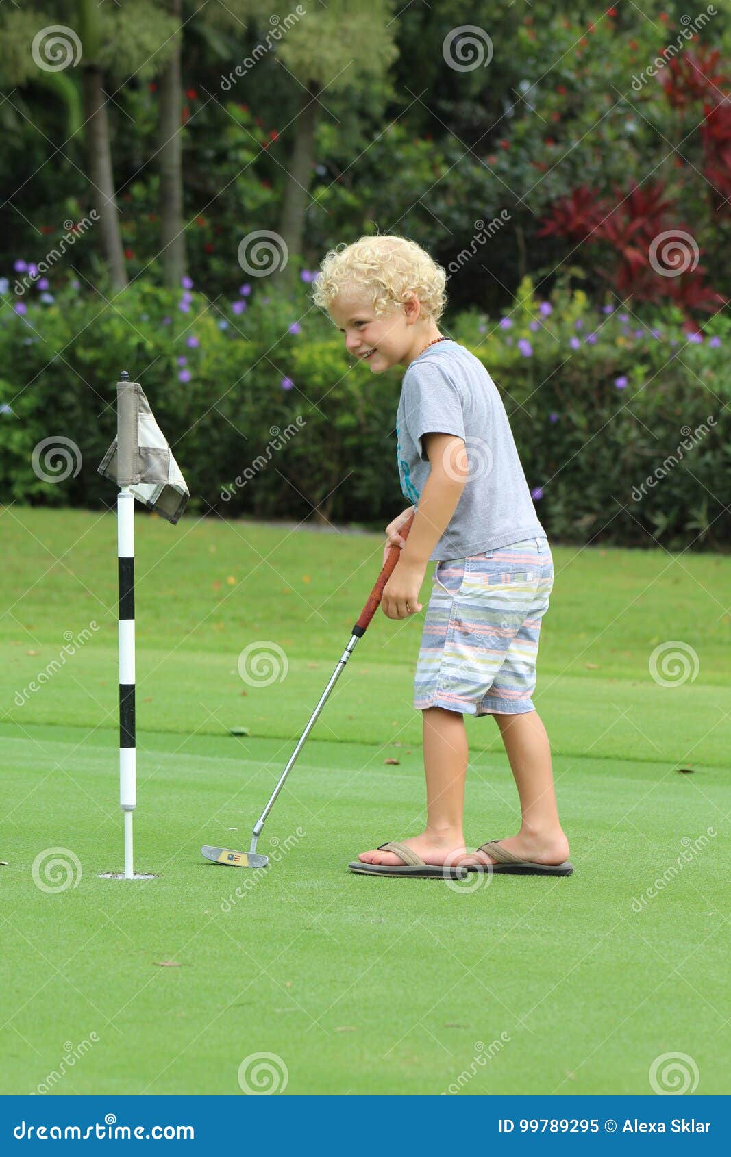Young boy playing golf stock image. Image of blonde, active - 99789295