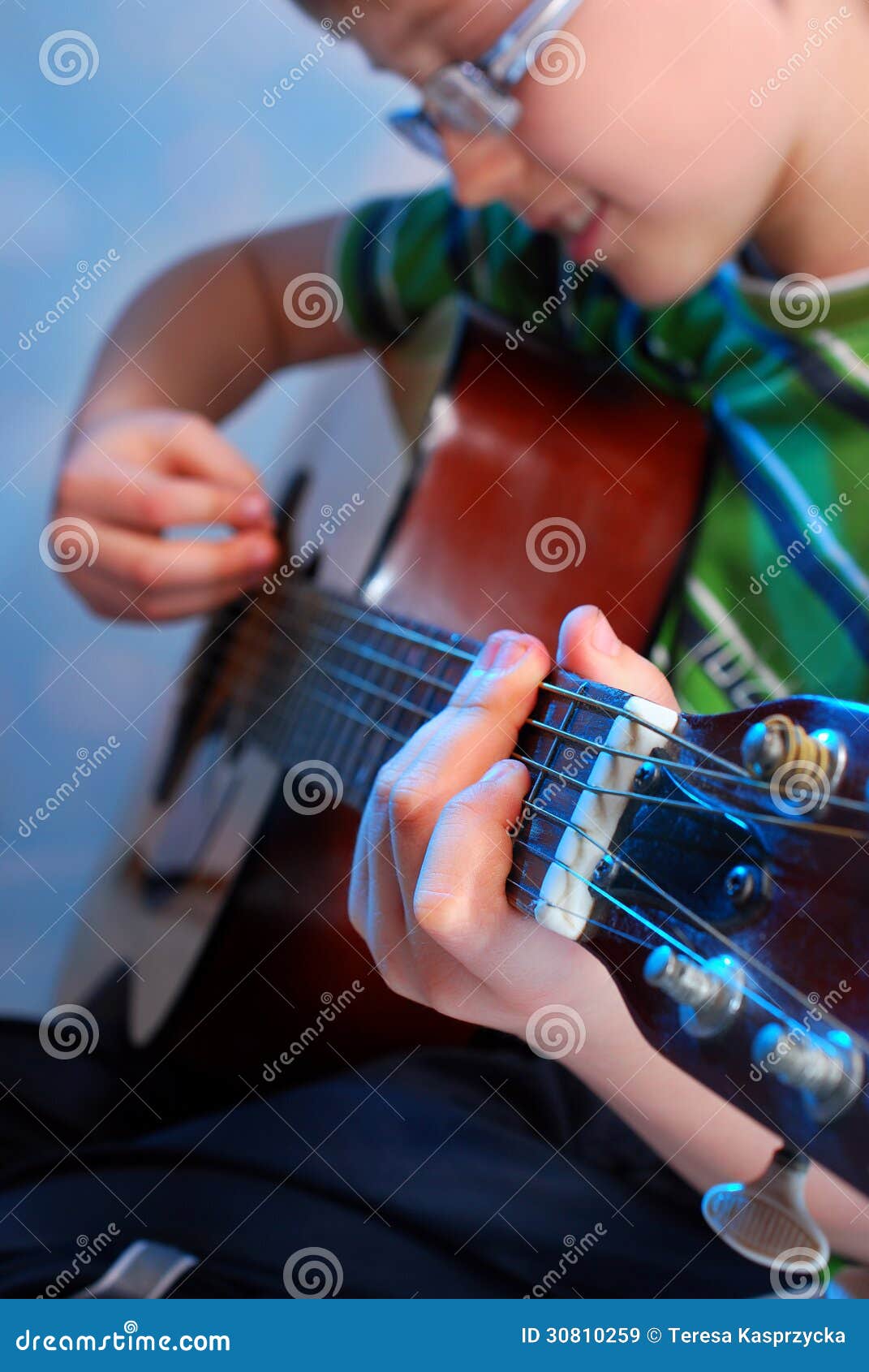 Young boy playing guitar stock image. Image of concert - 30810259