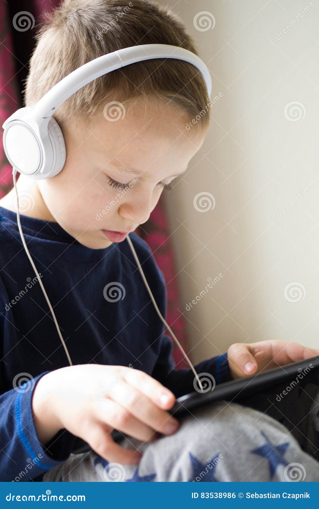Young Boy Playing on His Mobile Phone in Bed Stock Photo - Image of ...