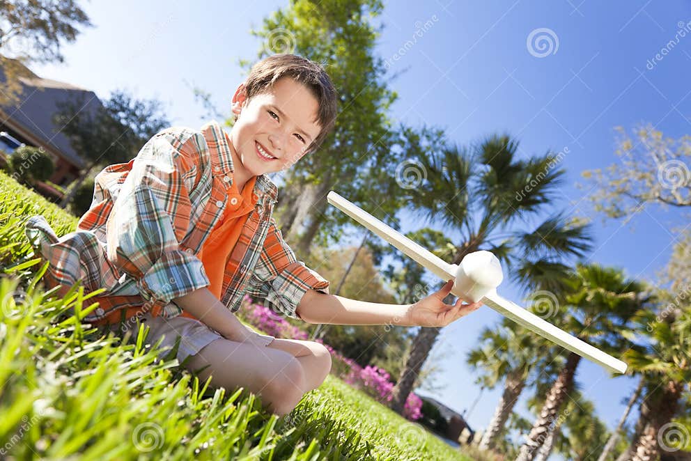 Young Boy Playing with Model Airplane Outside Stock Image - Image of ...