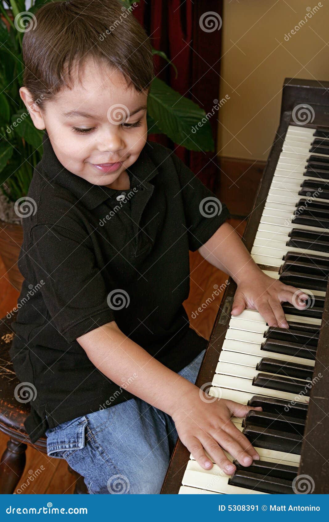 Young boy playing piano stock image. Image of musical - 5308391