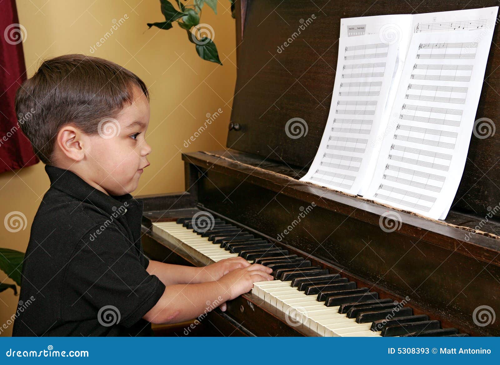 Young boy playing piano stock image. Image of piano, sheet - 5308393