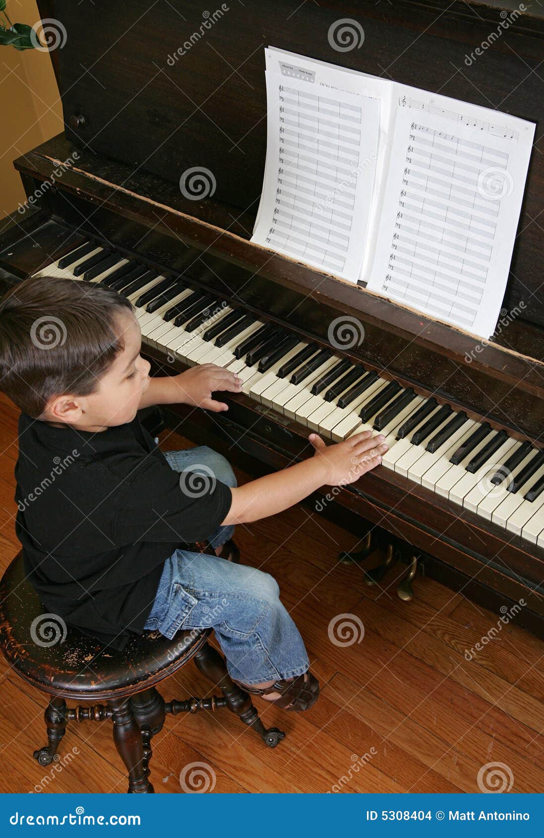 Young boy playing piano stock photo. Image of keyword - 5308404