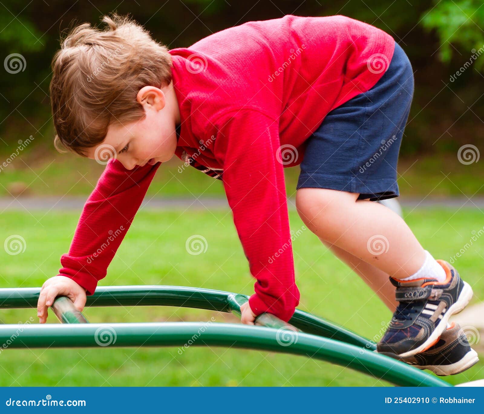 Young Boy Playing on Playground Stock Photo - Image of bars, happy ...