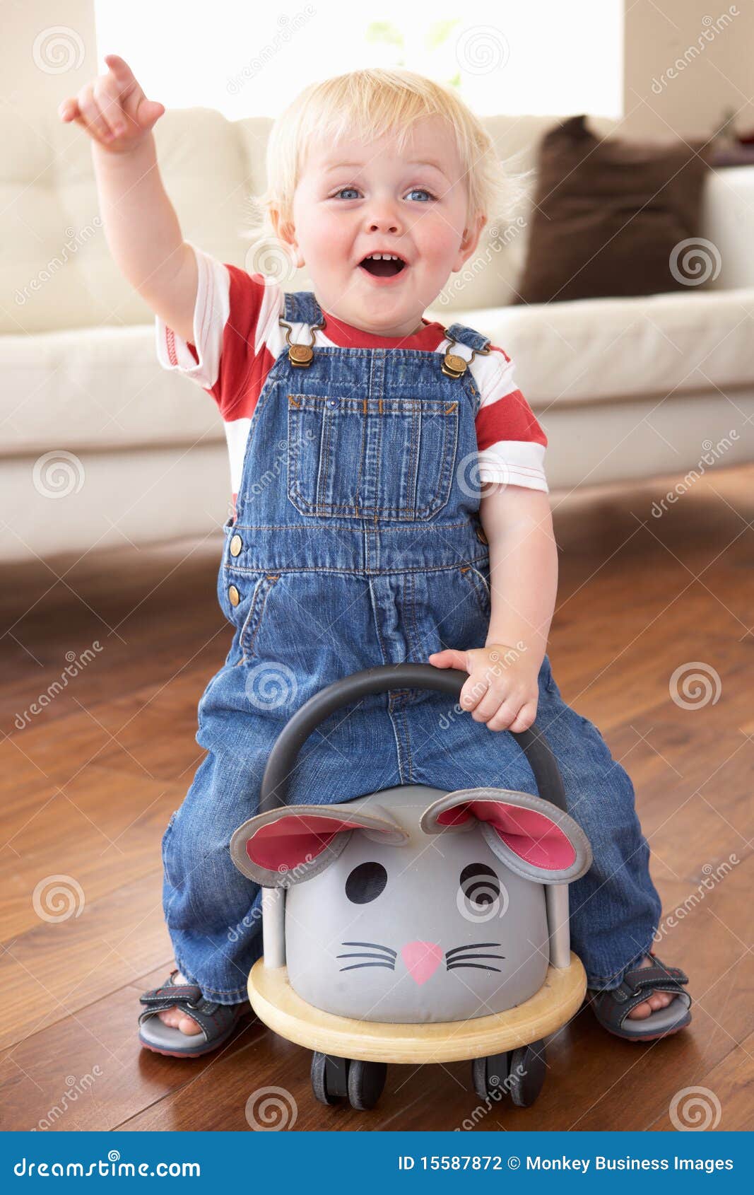 Young Boy Playing with Ride on Toy Mouse at Home Stock Photo - Image of ...