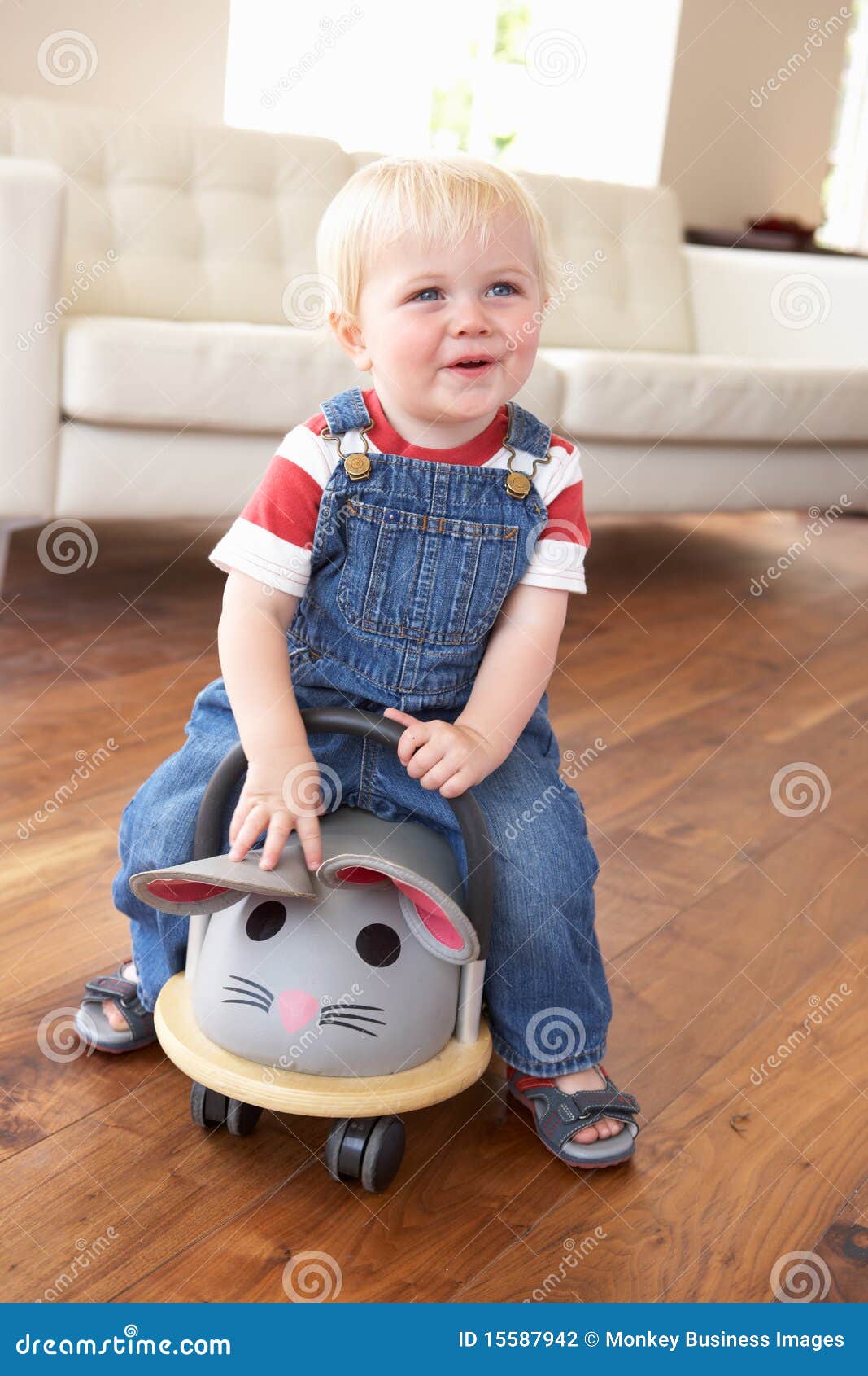 Young Boy Playing with Ride on Toy Mouse at Home Stock Photo - Image of ...