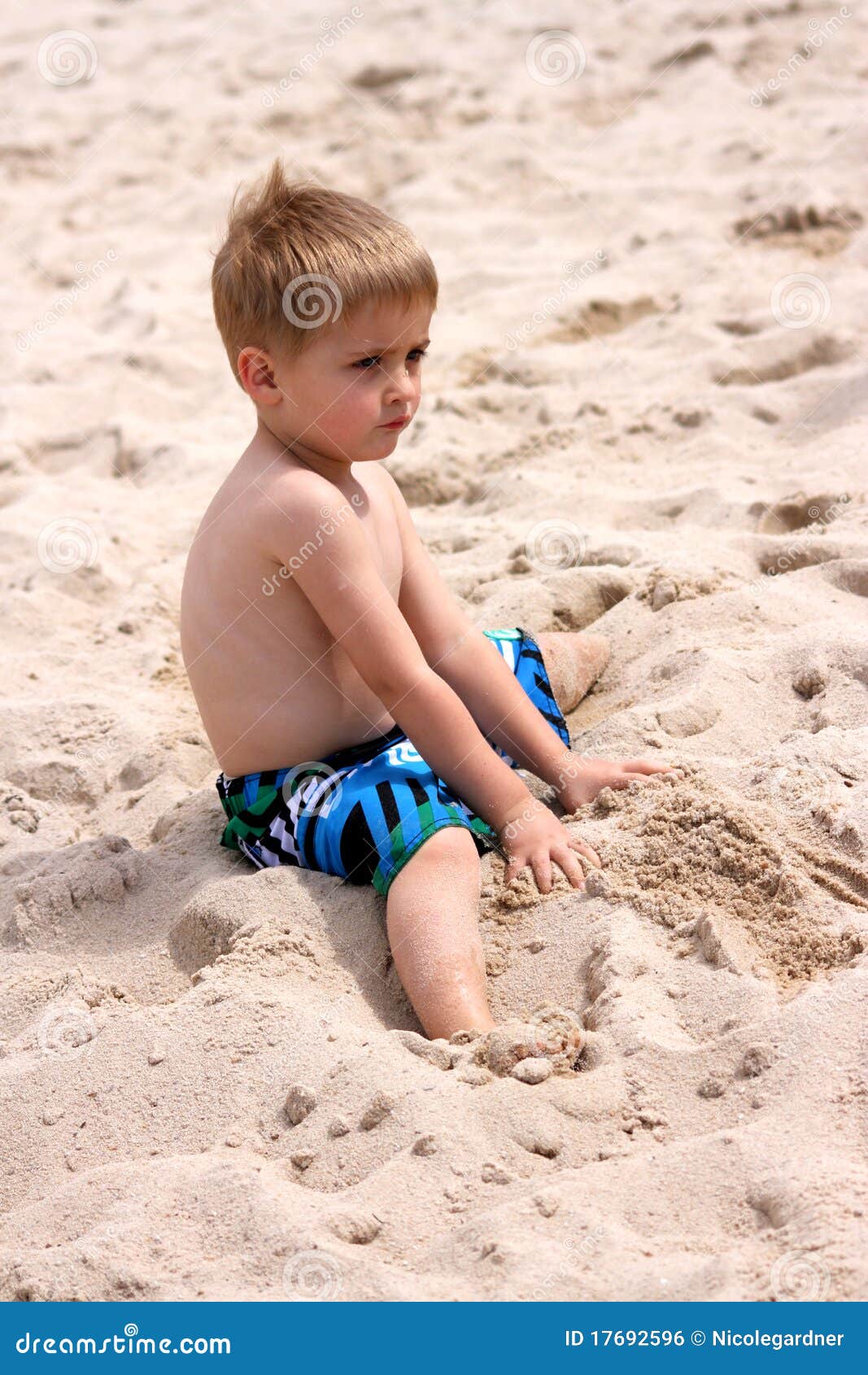 Young Boy Playing with Sand Stock Photo - Image of sand, shore: 17692596