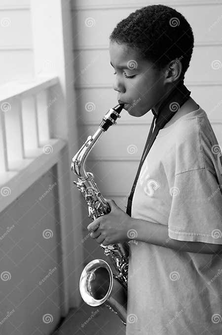 Young Boy Playing Saxophone Stock Photo - Image of african, black: 27445804