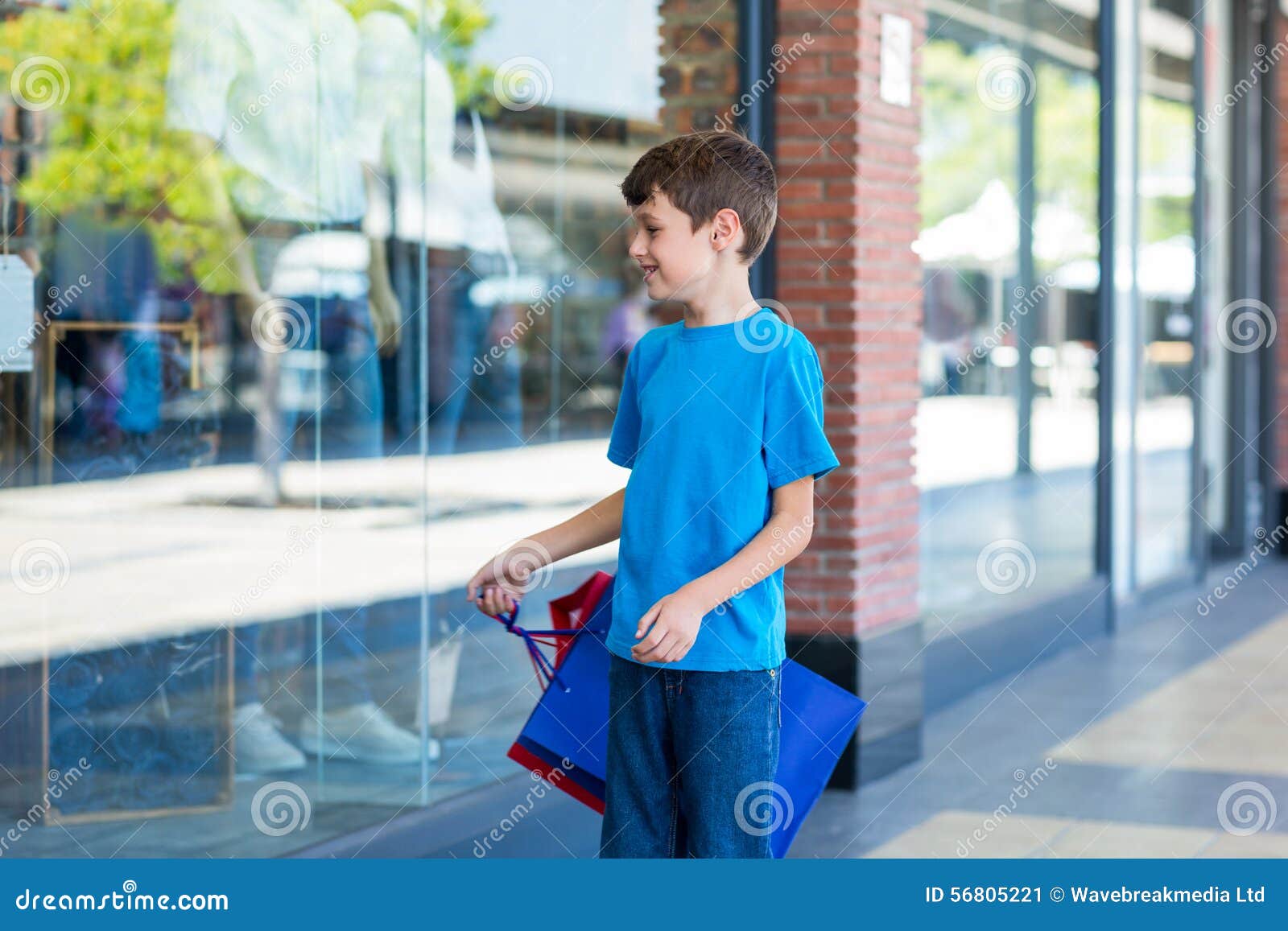 Young Boy Playing with Shopping Bags Stock Image - Image of customer ...