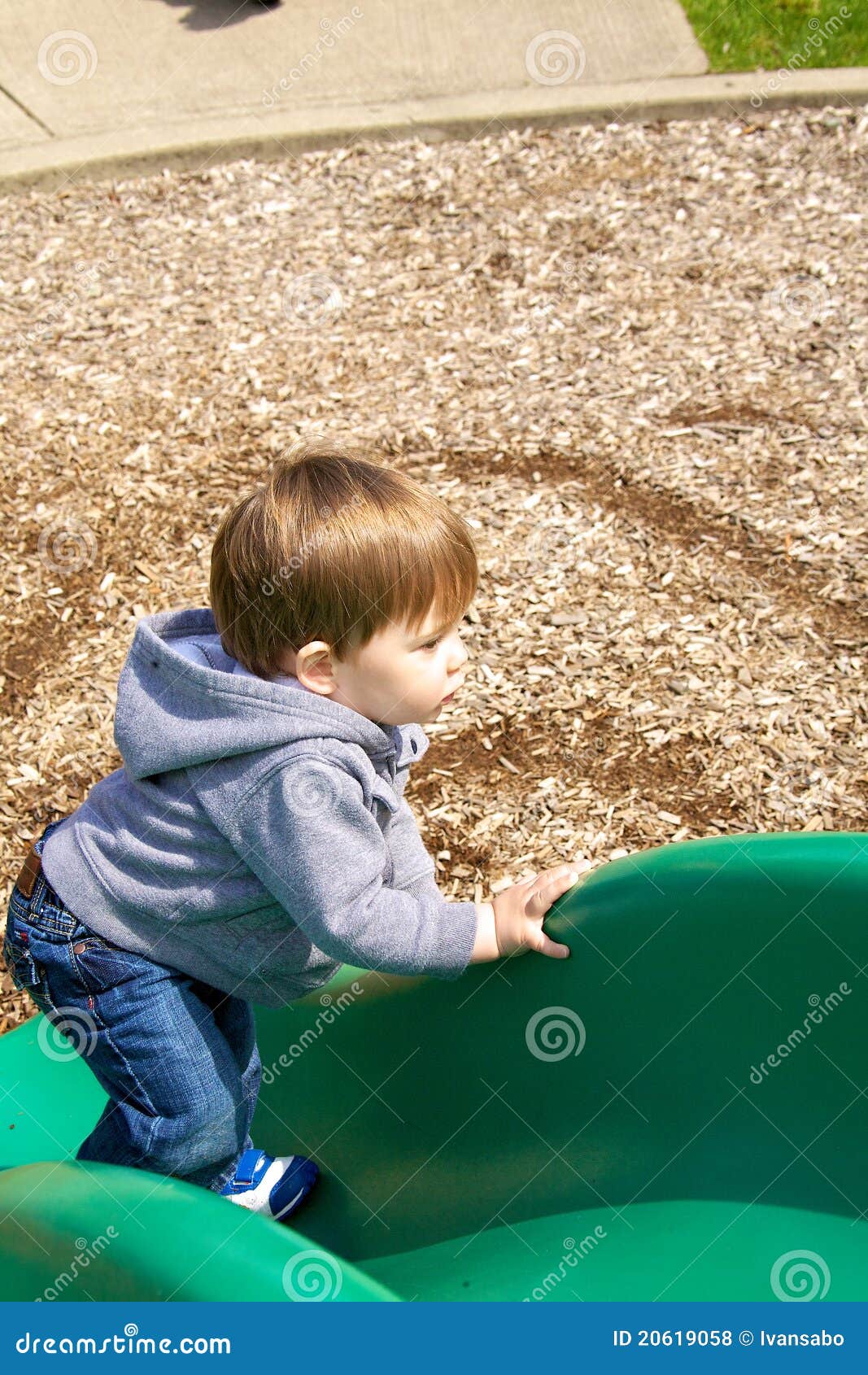 Young boy playing on slide stock photo. Image of childhood - 20619058