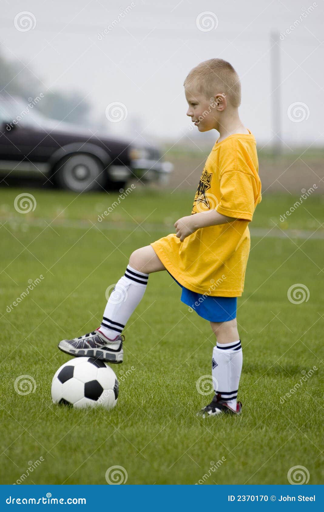 Young boy playing soccer stock photo. Image of spring - 2370170