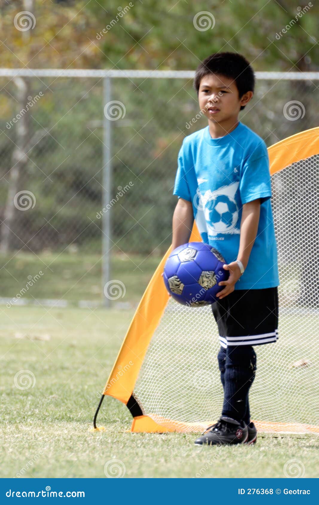 Young Boy Playing in Soccer Stock Photo - Image of kids, children: 276368