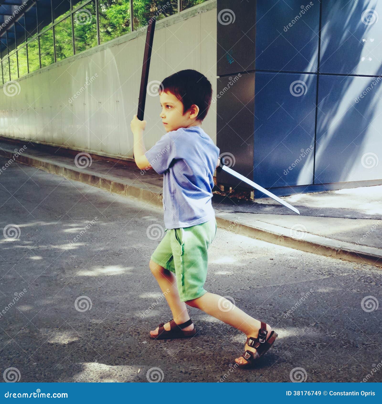 Young Boy Playing with Sword Stock Image - Image of play, arts: 38176749