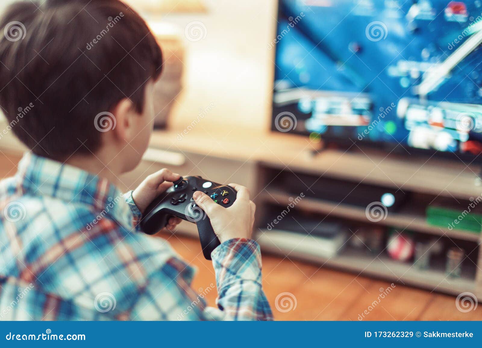 Young Boy Playing Video Game on Console by Controller Stock Image ...