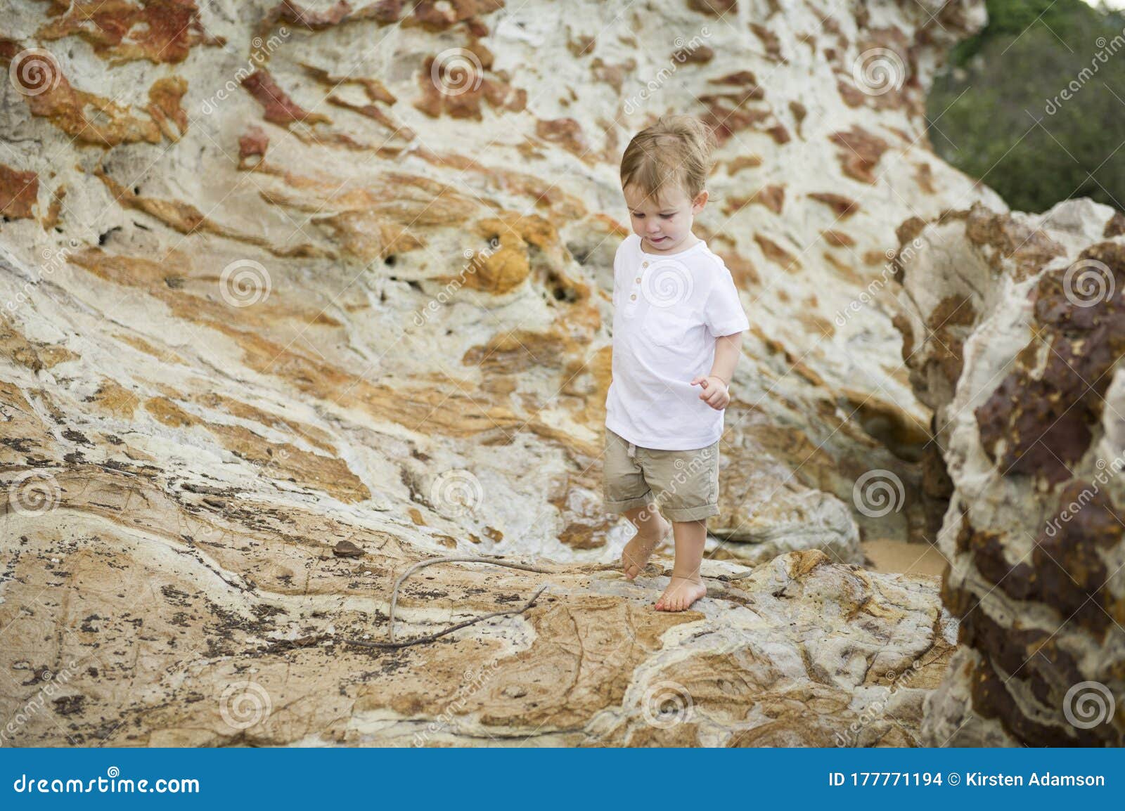 Young Boy Playing and Walking on Rocks Stock Photo - Image of earth ...