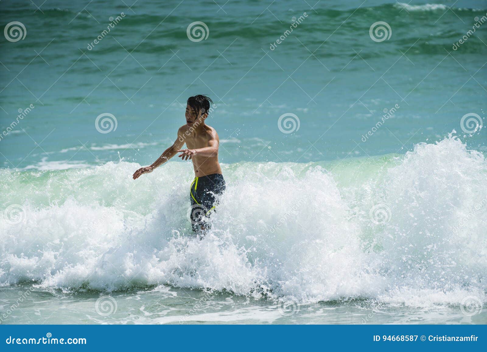Young Boy Playing in the Waves Stock Image - Image of beauty, beautiful ...