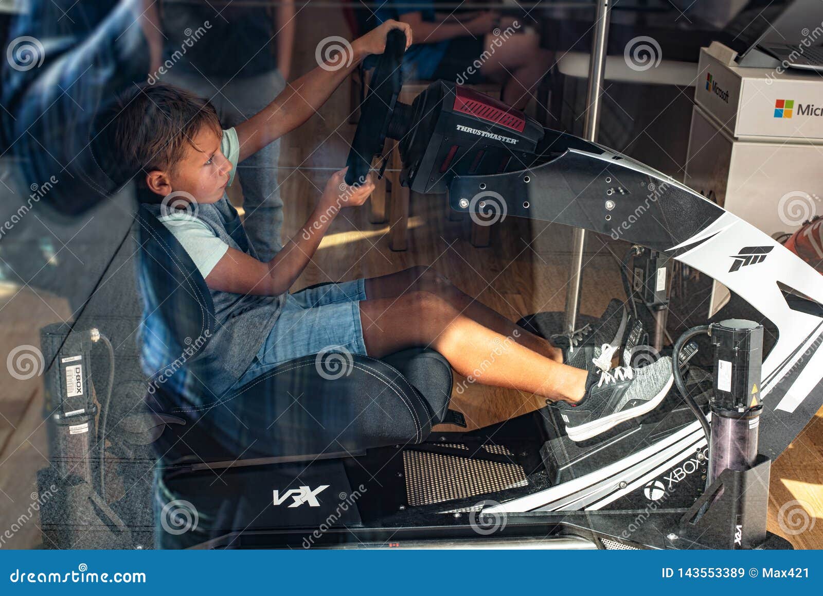 Young Boy Playing XBox Racing Car Simulator Editorial Stock Image ...