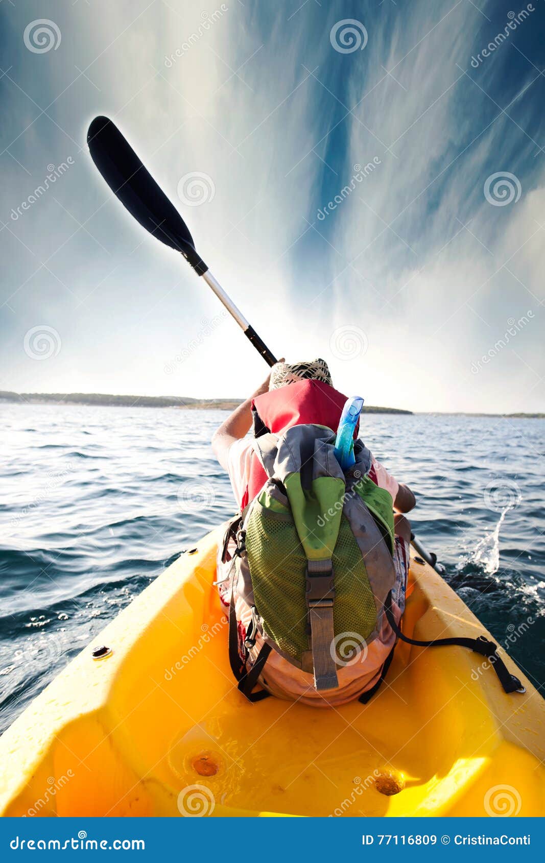 Young Boy Plows through the Waters of the Sea with His Canoe Stock ...