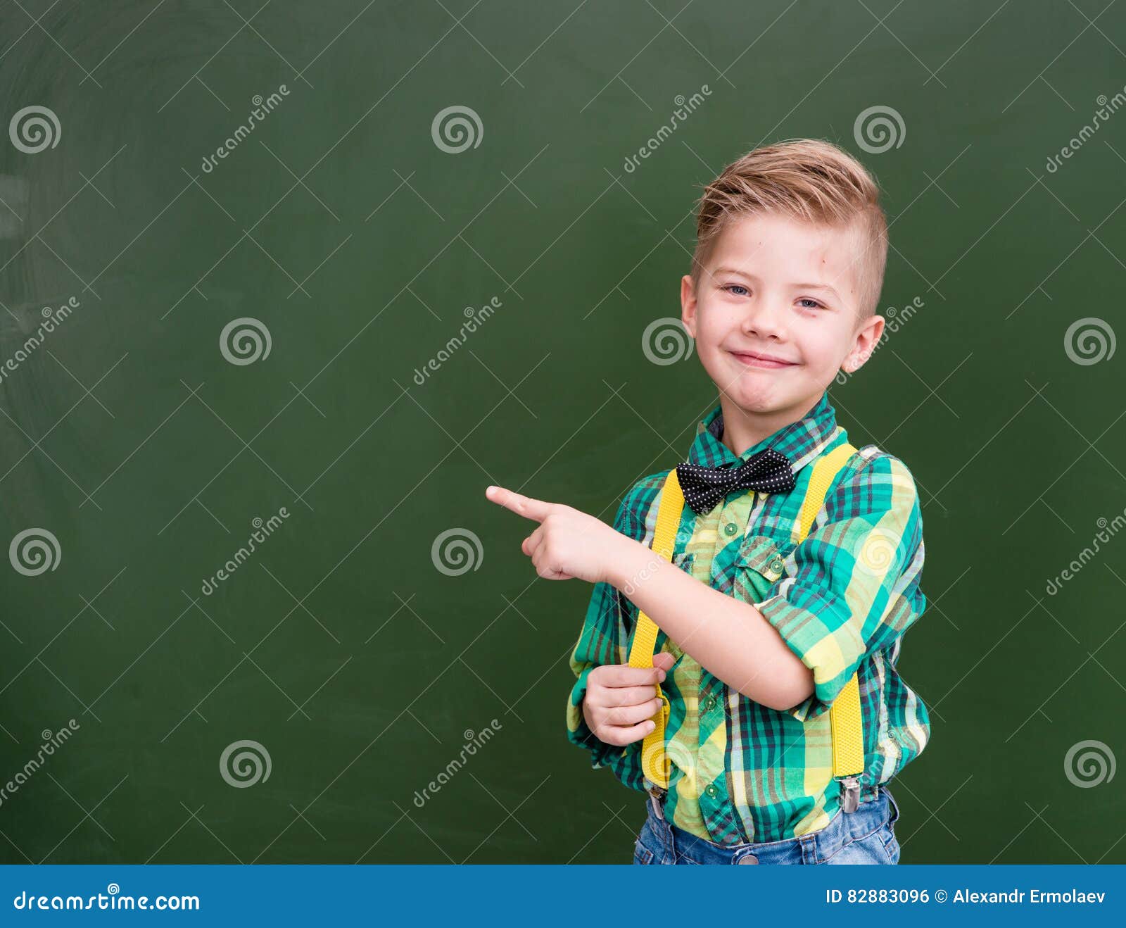 Young Boy Points on Empty Green Chalkboard Stock Photo - Image of ...