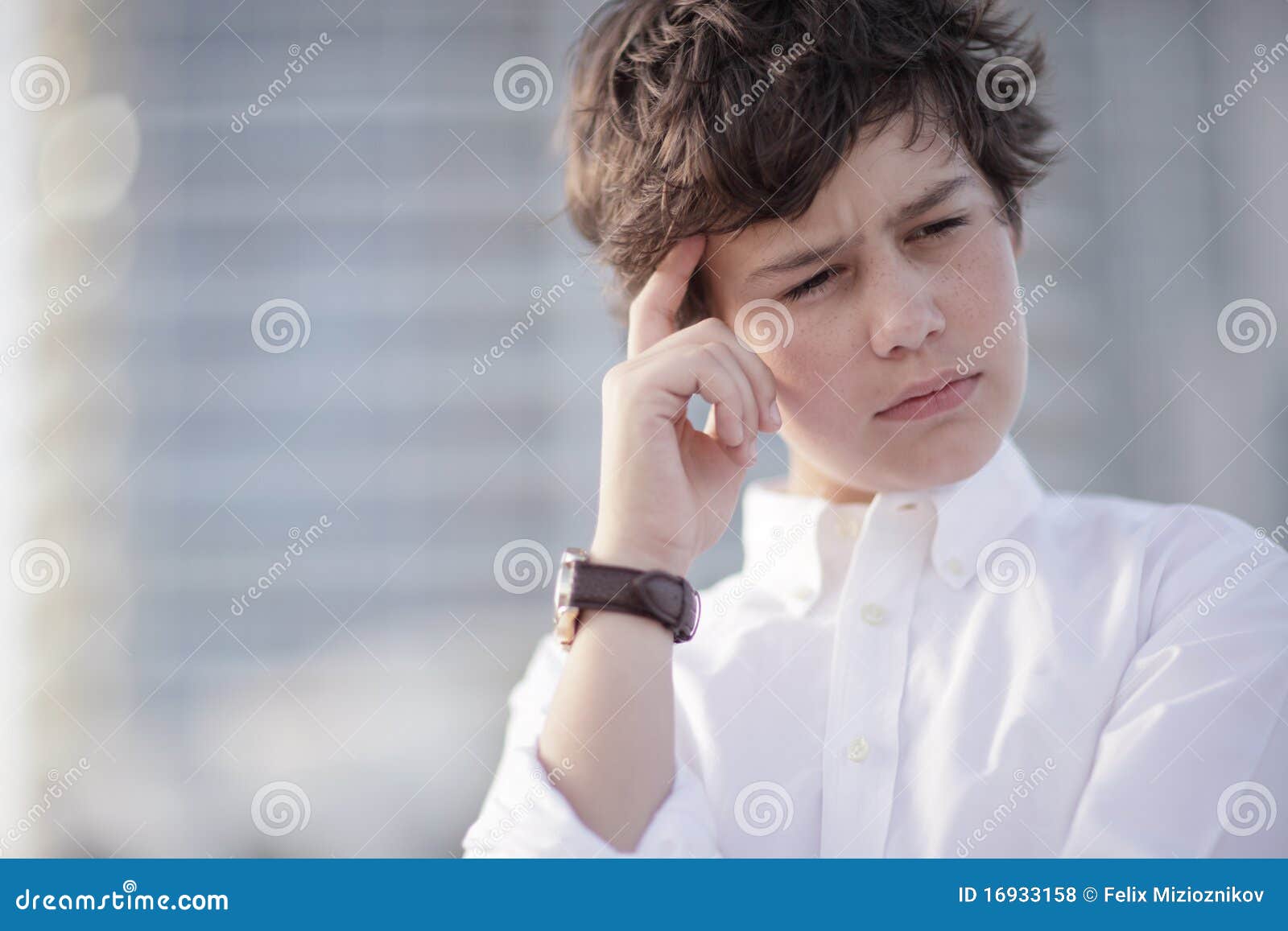 Young boy pondering stock photo. Image of think, hand - 16933158