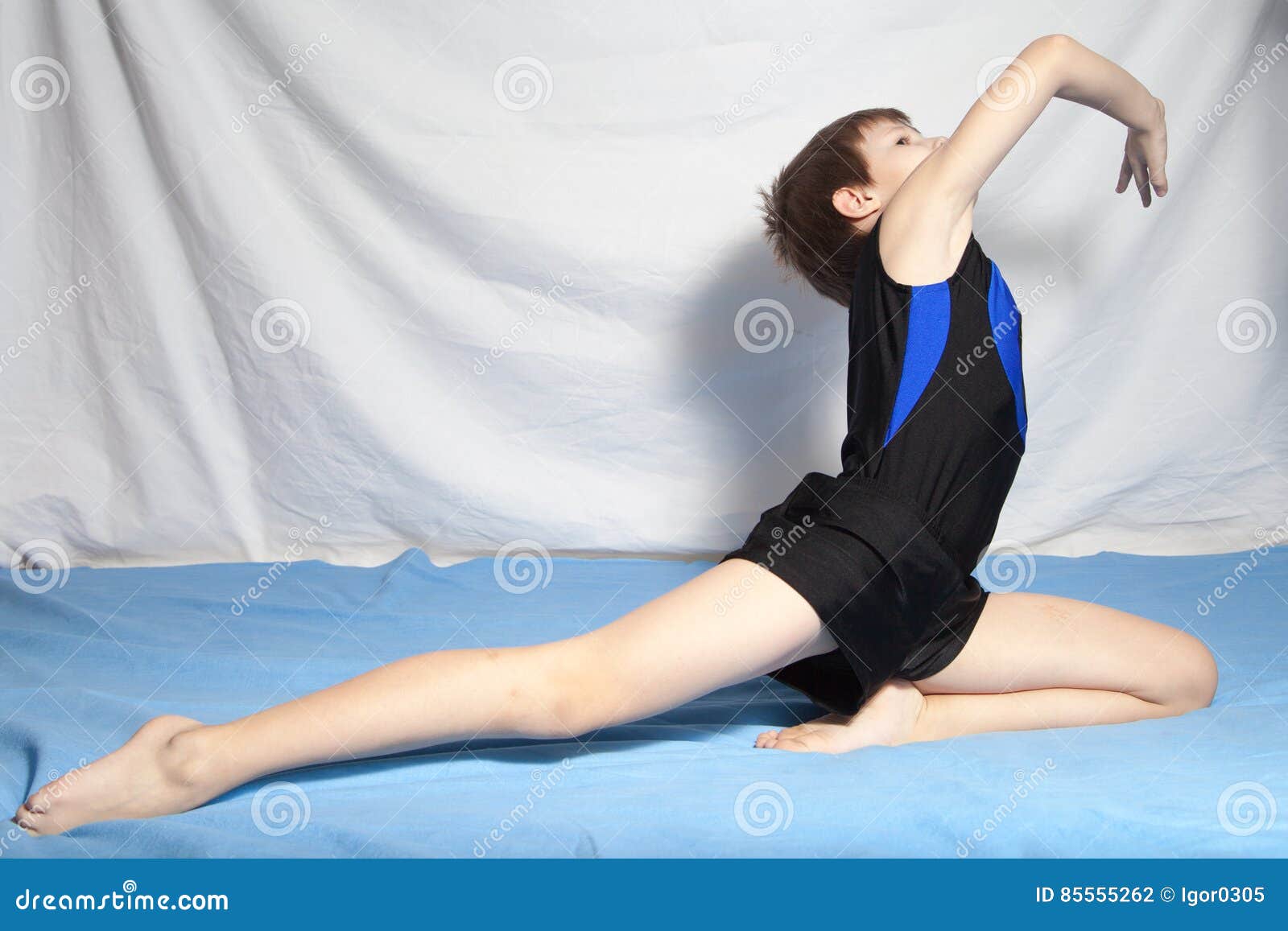 Young boy practices yoga stock photo. Image of sitting - 85555262