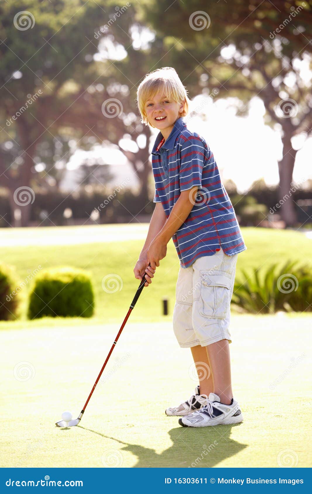 Young Boy Practising Golf stock image. Image of practising - 16303611