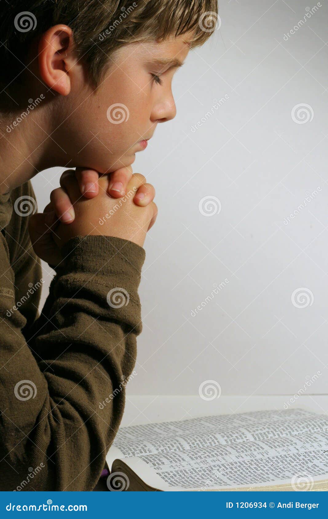 Young Boy Praying Over the Bible Stock Photo - Image of holy, devotion ...