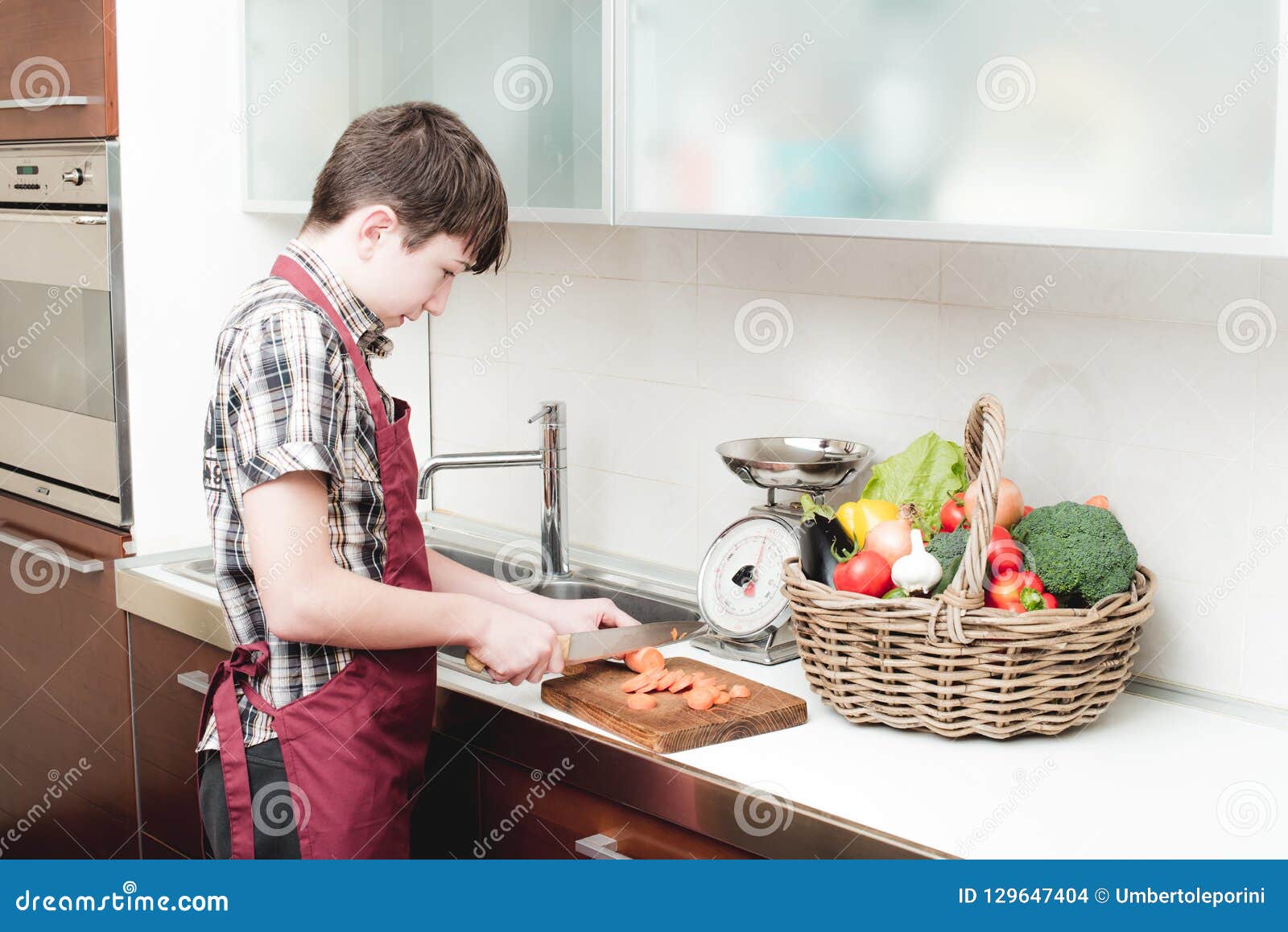 Young Boy Prepare Vegetables Over the Bench Stock Photo - Image of ...