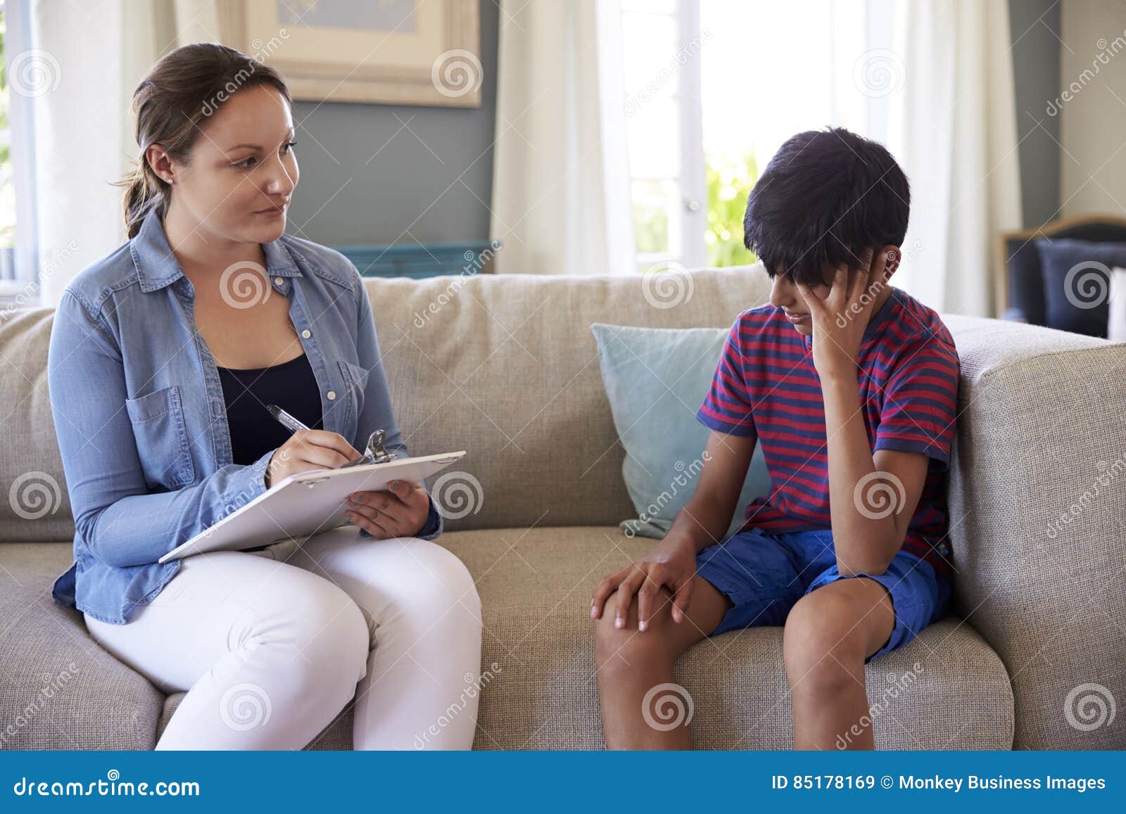 Young Boy with Problems Talking with Counselor at Home Stock Image ...