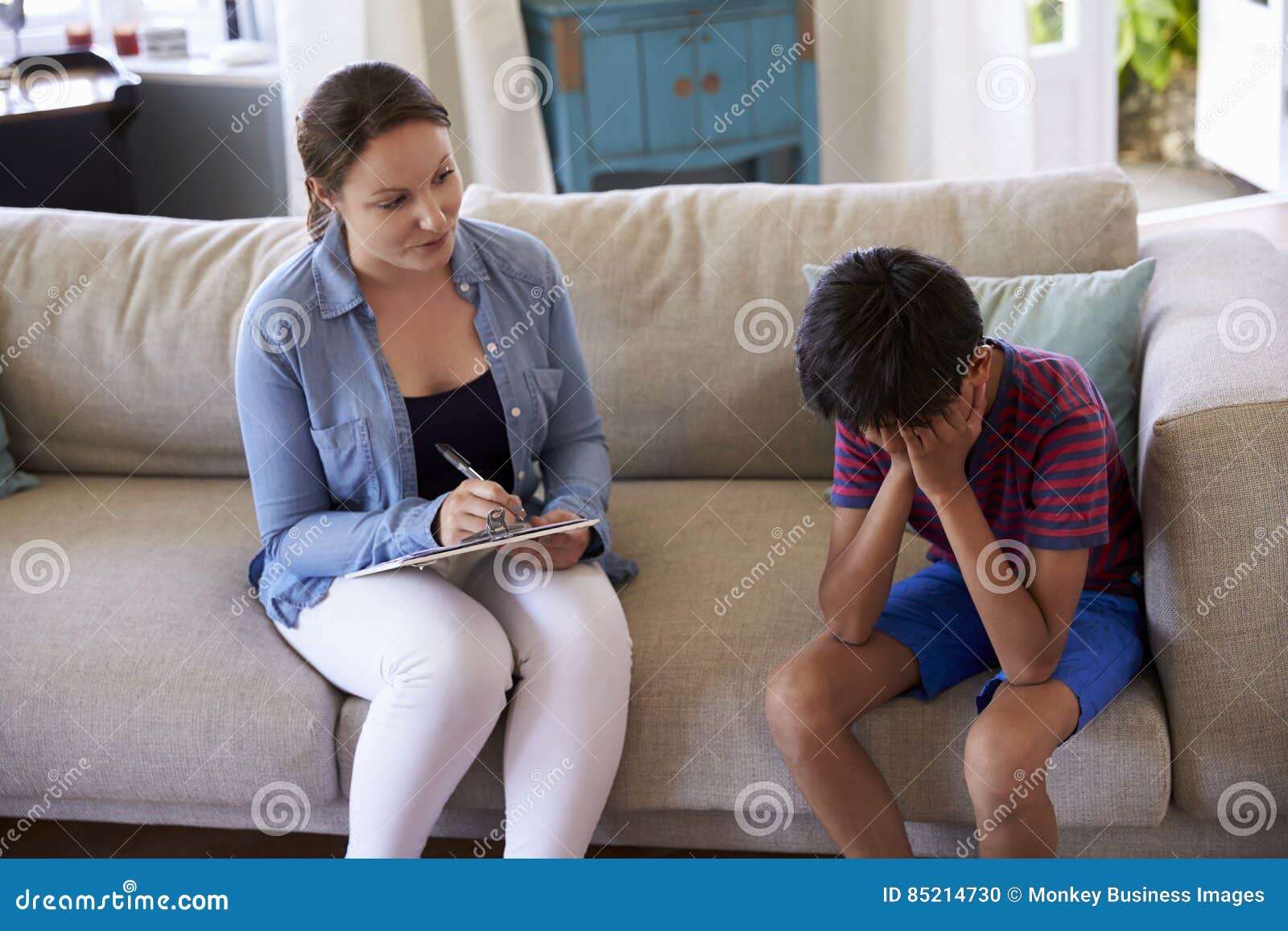 Young Boy with Problems Talking with Counselor at Home Stock Photo ...