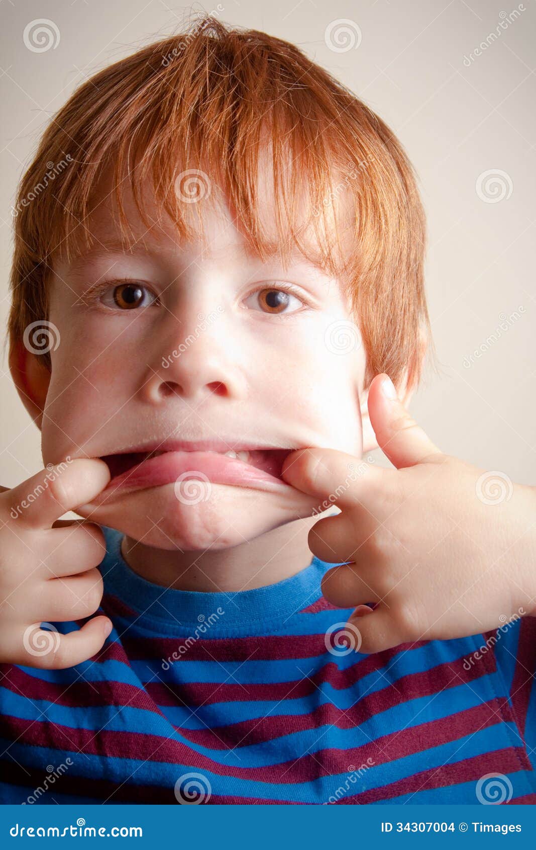 Young Boy Pulling A Face Stock Photo | CartoonDealer.com #34307004