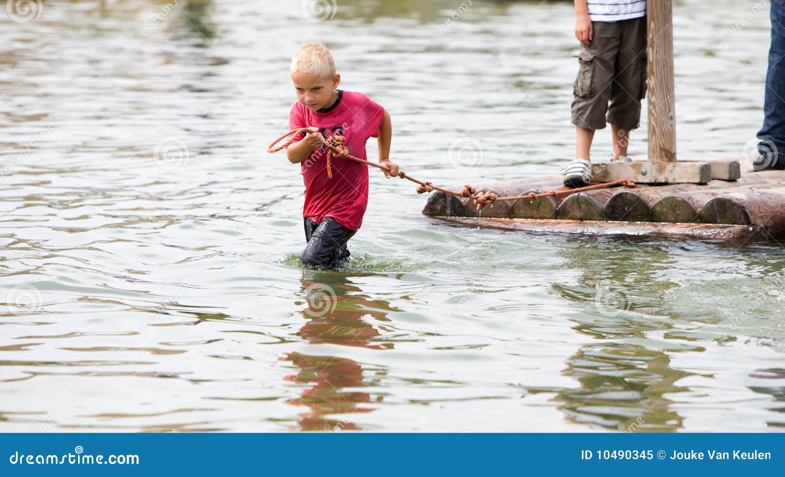 Young Boy is Pulling a Raft Stock Image - Image of little, rope: 10490345