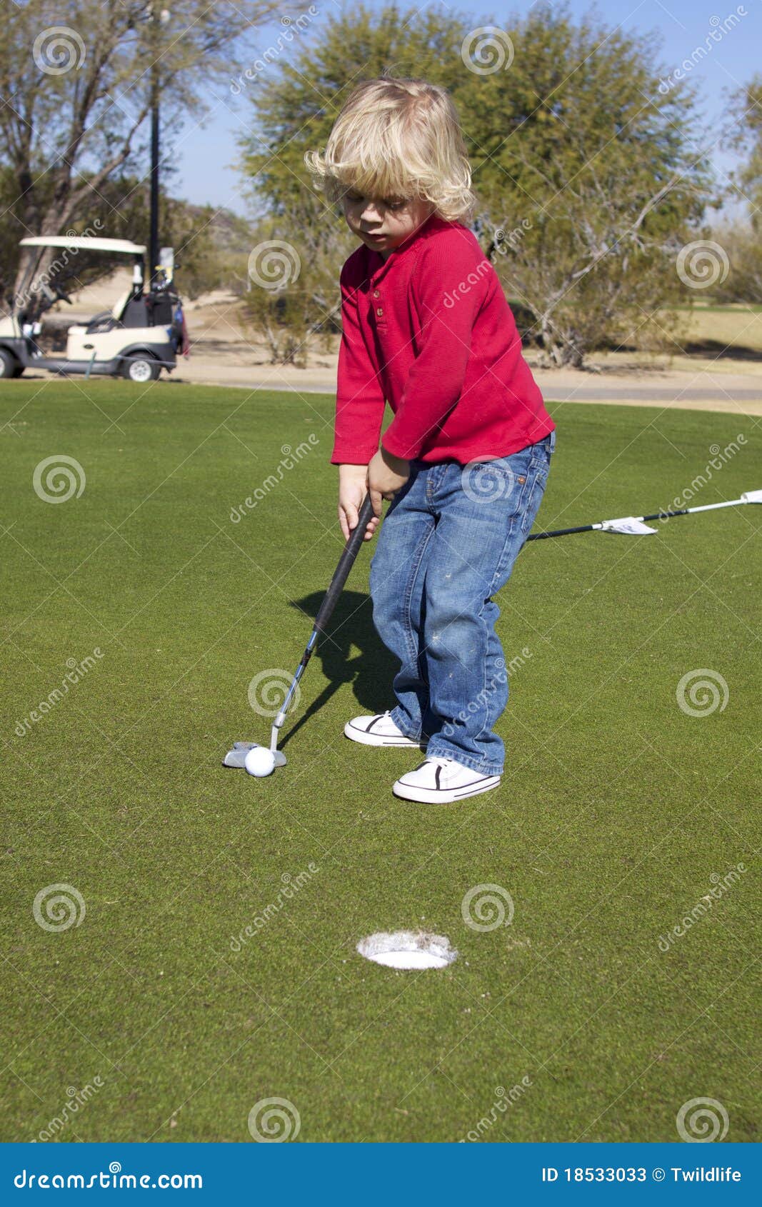 Young Boy Putting stock image. Image of putt, child, curly - 18533033