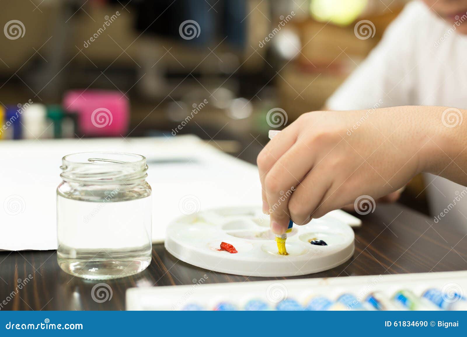 Young Boy Putting Paint Palete on His Painting Stock Photo - Image of ...