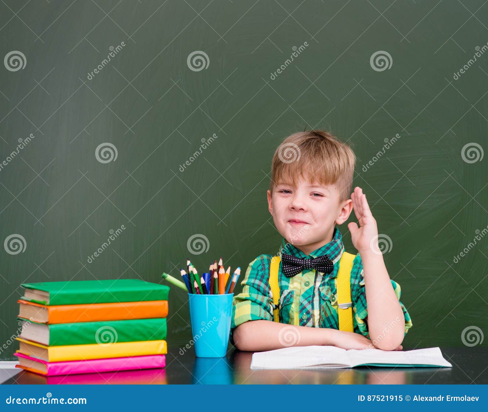 Young Boy Raising Hand Knowing the Answer To the Question Stock Image ...