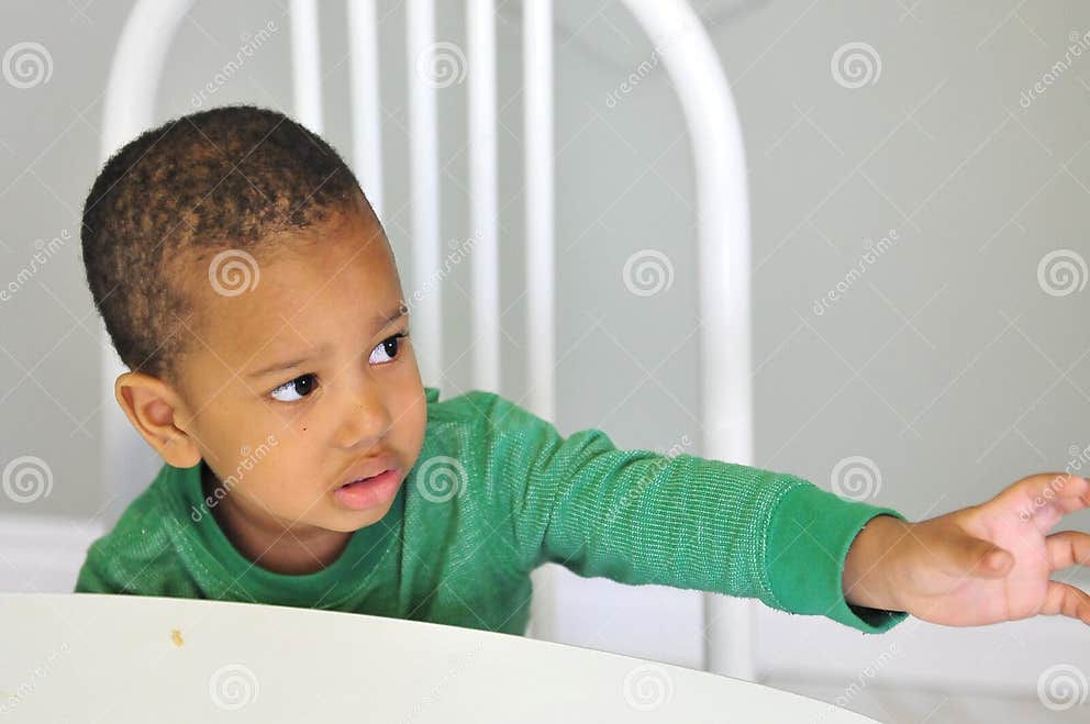 Young Boy Reaching for Something Stock Image - Image of gesturing ...