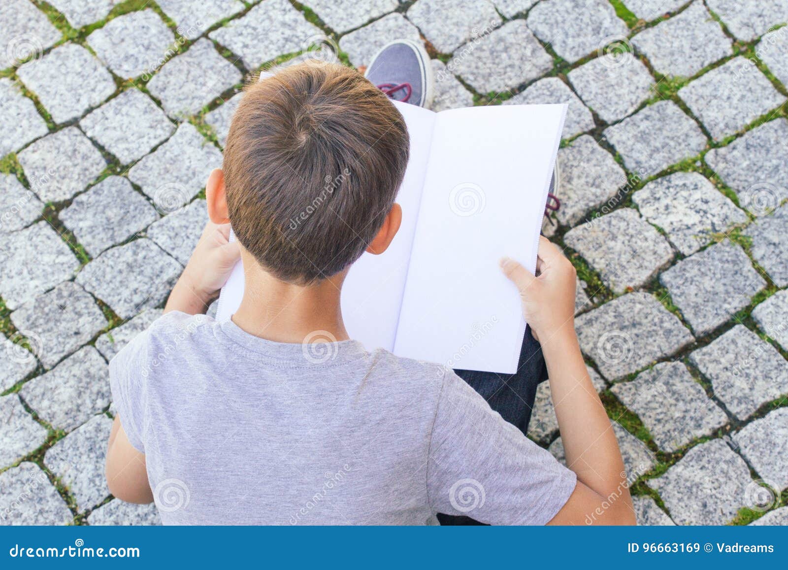 Young Boy Reading Book Outdoors Stock Image - Image of education ...