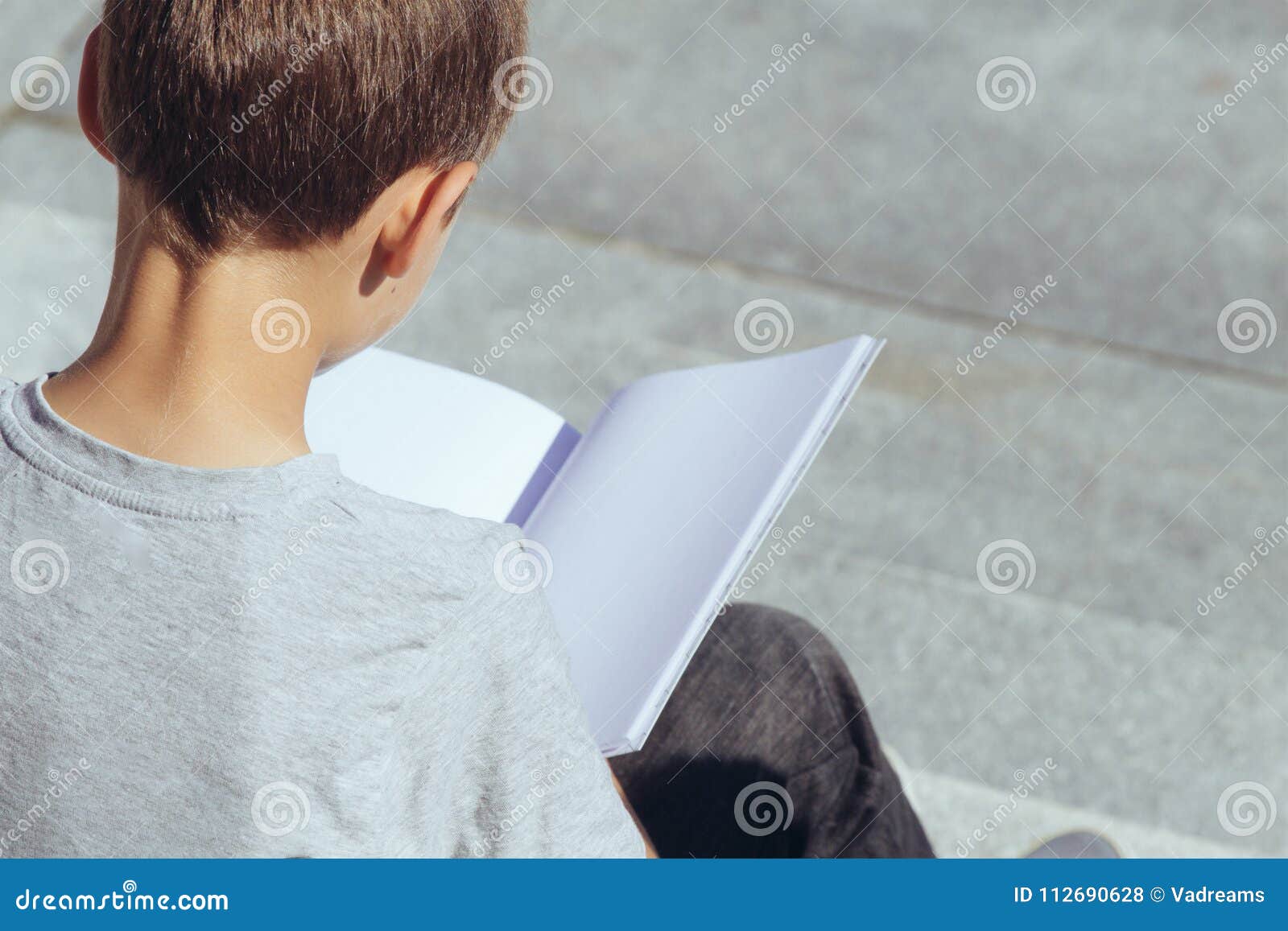 Young Boy Reading Book Outdoors Stock Photo - Image of homework ...
