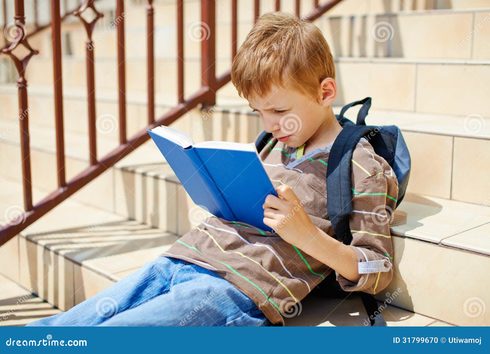 Young boy is reading book stock photo. Image of attractive - 31799670