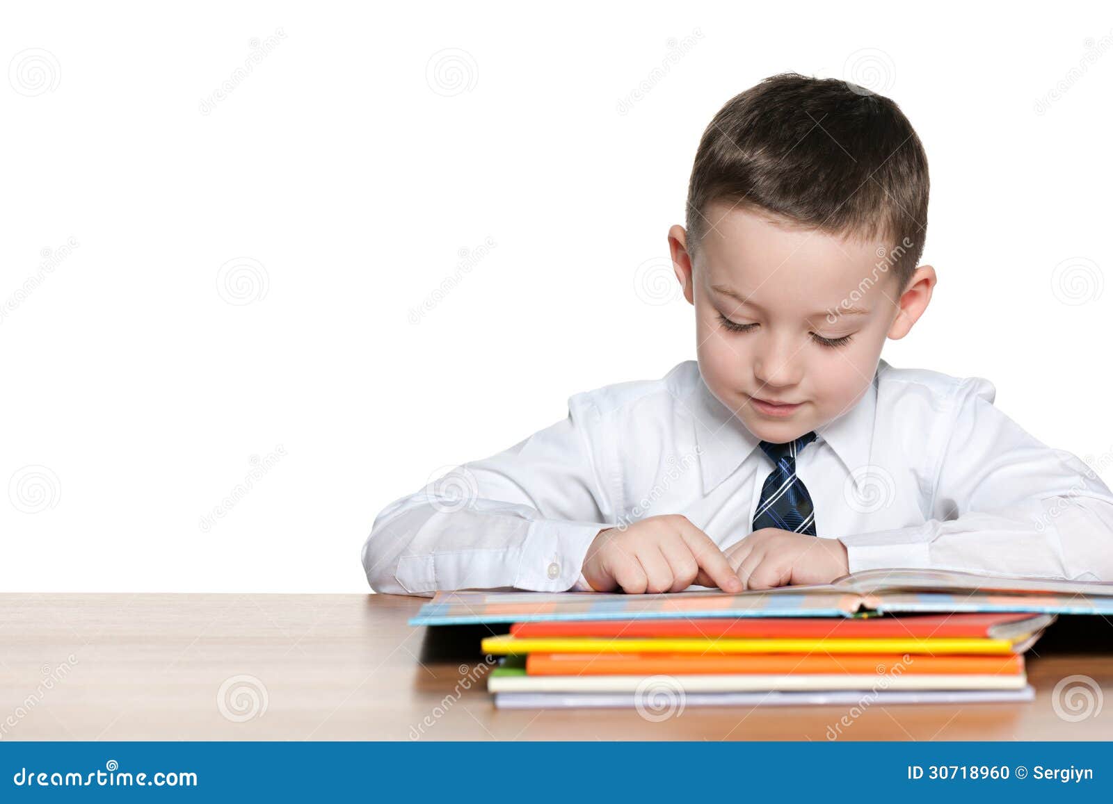 Young Boy is Reading at the Desk Stock Photo - Image of book, mood ...