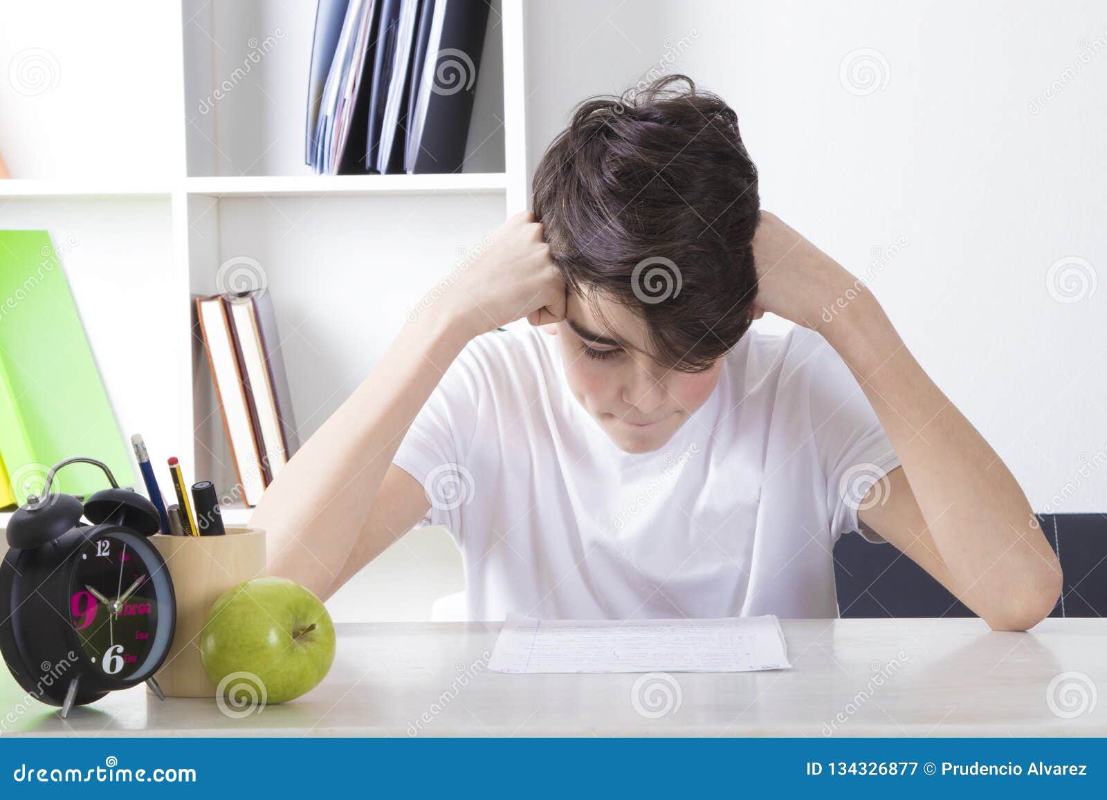 Boy reading at desk stock image. Image of papers, educating - 134326877