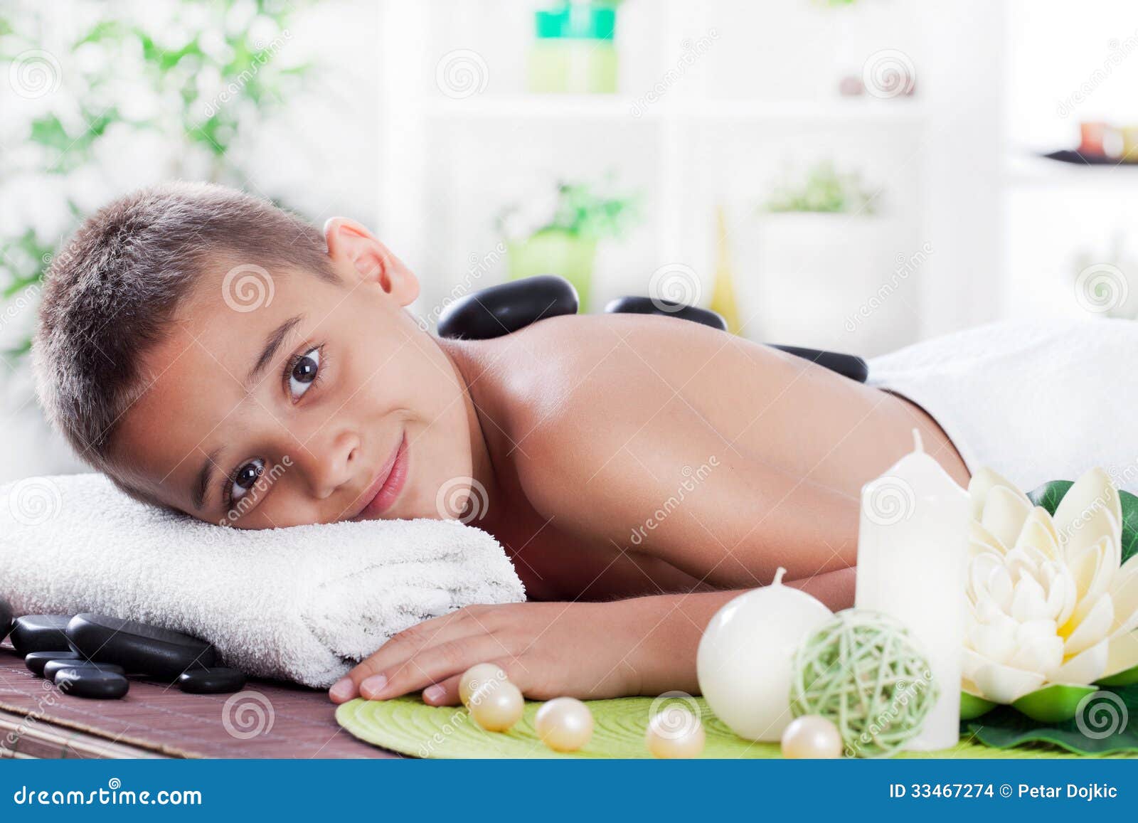 Young Boy Relaxing in Spa Salon Stock Photo - Image of candle, body ...