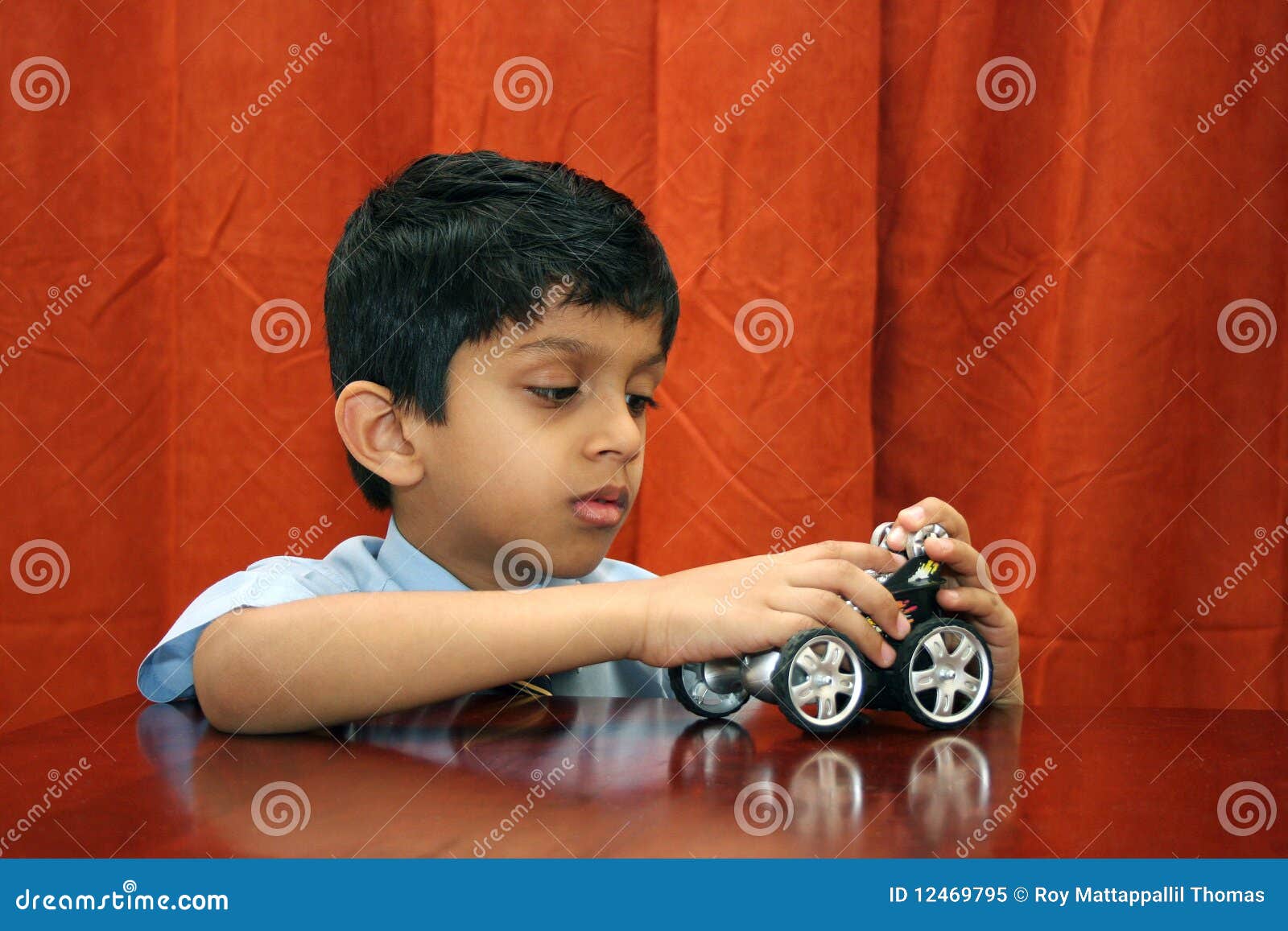 Young Boy Repairing Toy Car Stock Image - Image of carefull, curiously ...