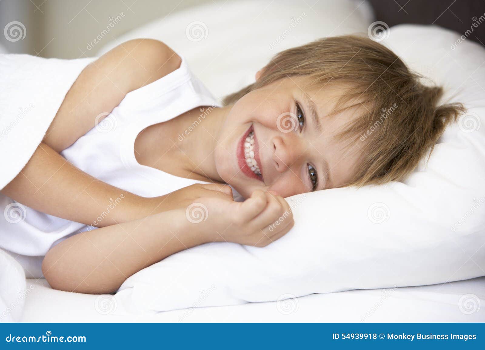 Young Boy Resting in Bed stock photo. Image of home, young - 54939918