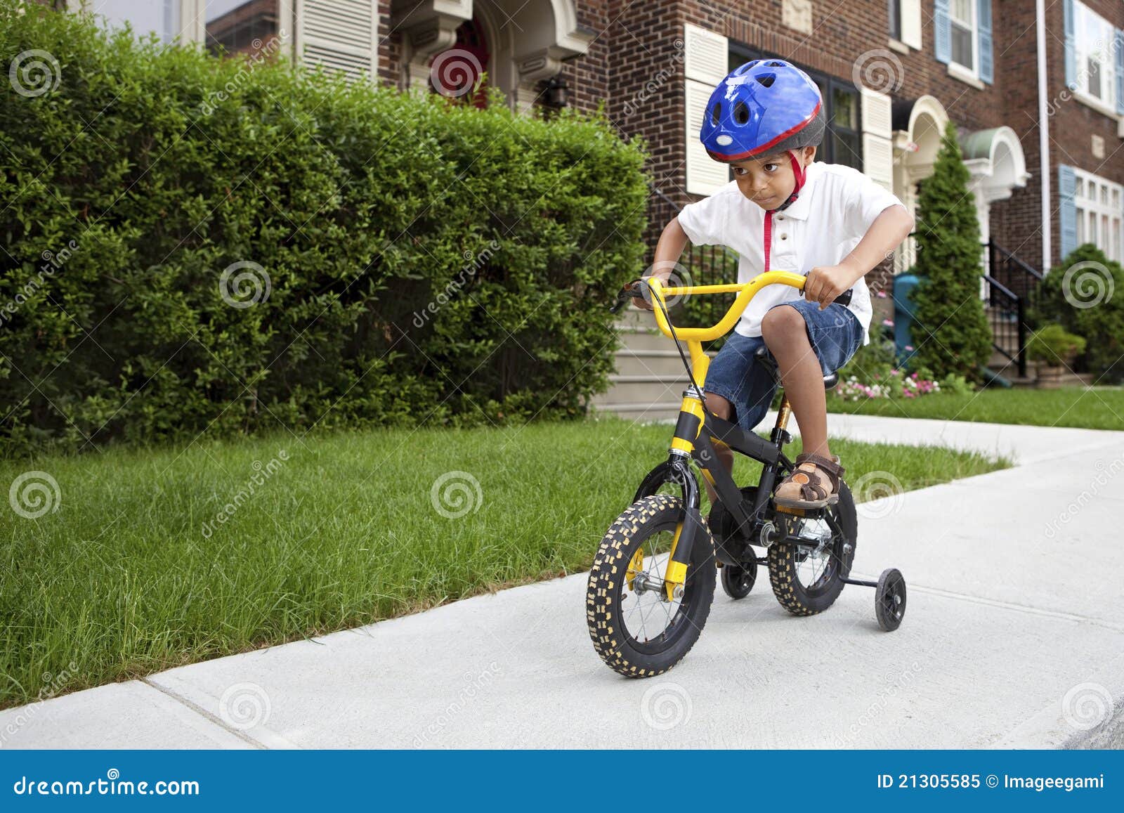 Young Boy Riding His Bicycle Royalty Free Stock Photo - Image: 21305585