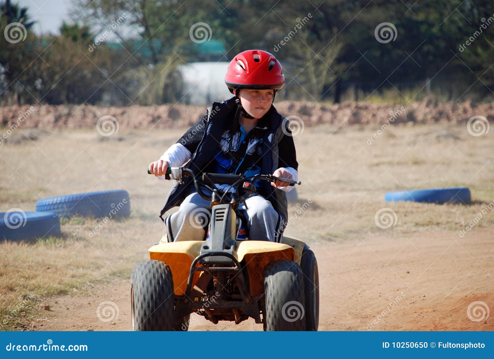 Young Boy Riding a Quadbike Stock Photo - Image of track, quick: 10250650