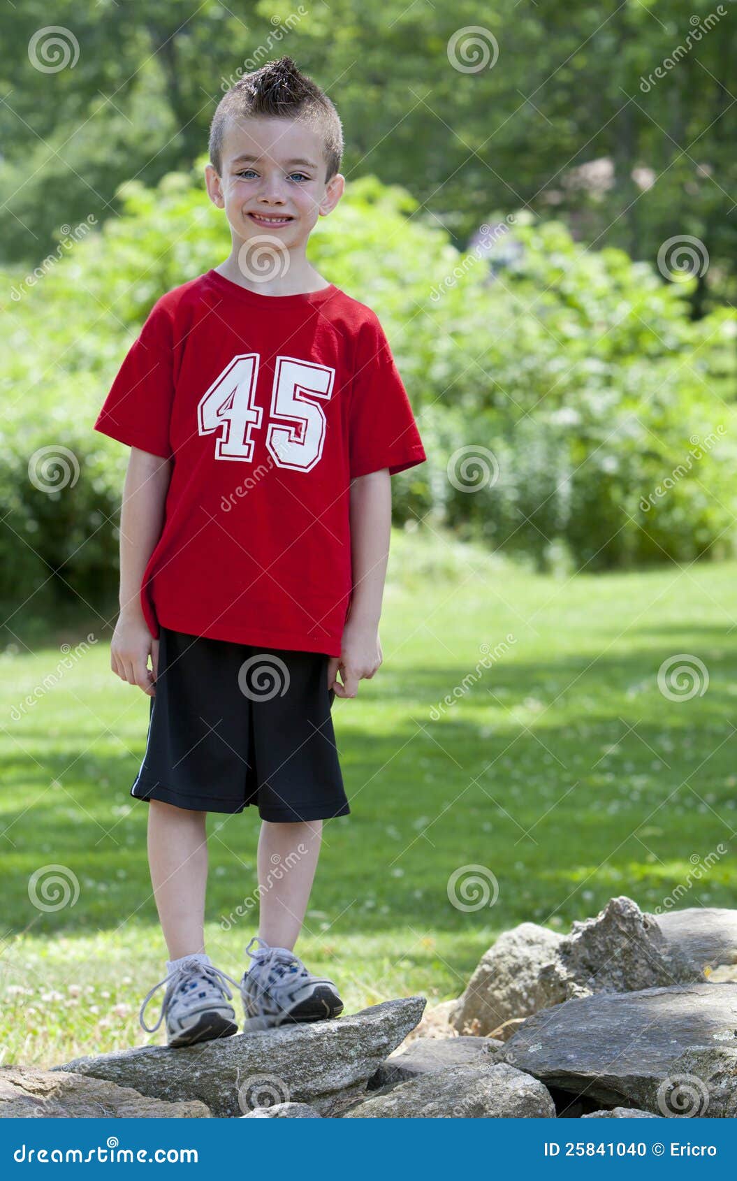 Young boy on rocks stock photo. Image of park, play, green - 25841040