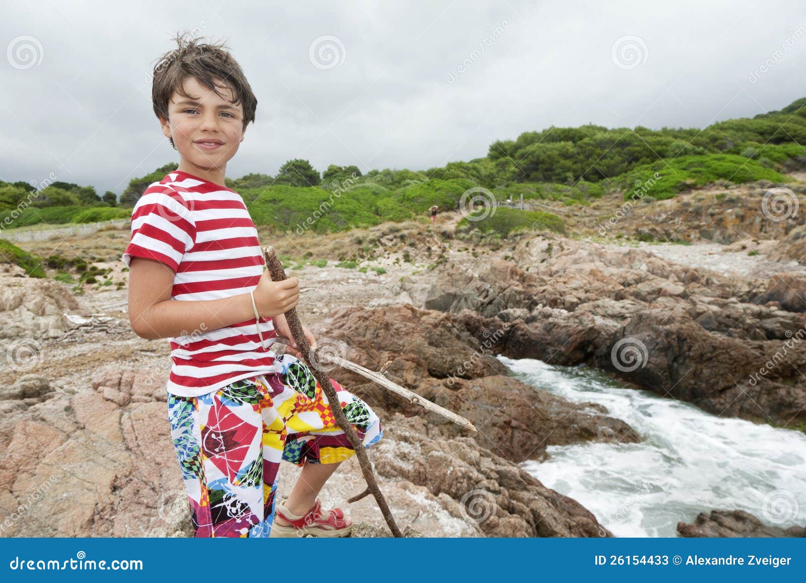 Young Boy on the Rocks in Front of the Sea Stock Image - Image of smile ...