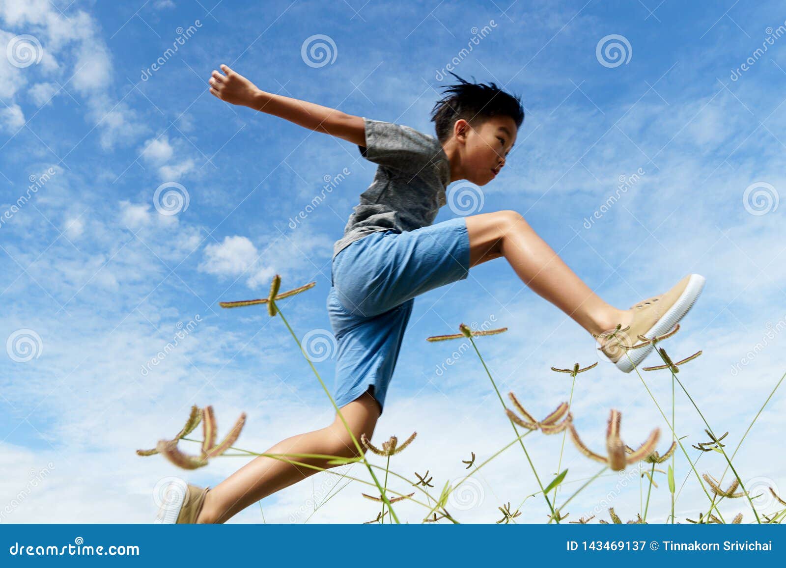 Young boy run and jump stock image. Image of smile, success - 143469137